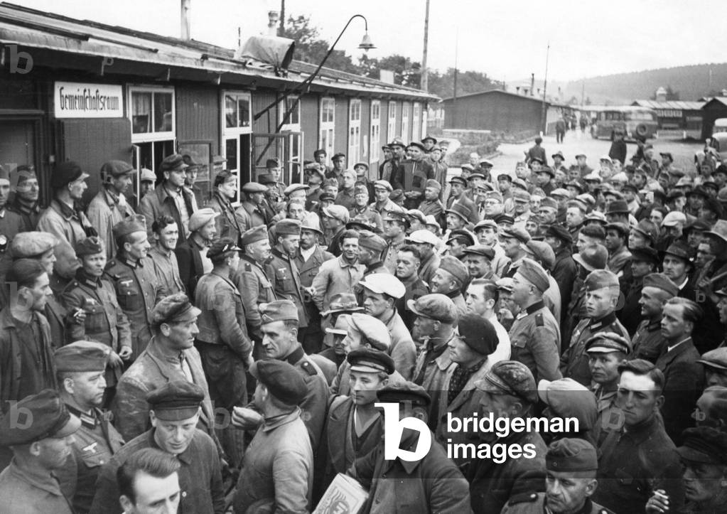Image of Soldiers and workers listen to a speech of Adolf Hitler,