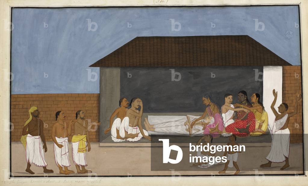 Image of The corpse is washed and dressed and laid out on