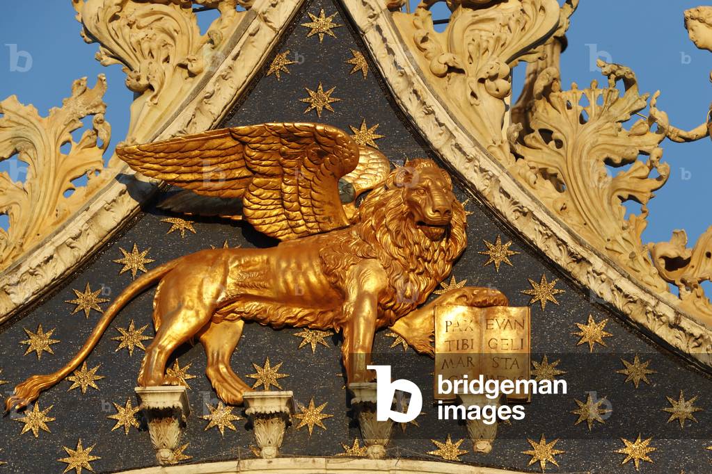 Image of Lion of Saint Mark and church. Basilica San Marco.