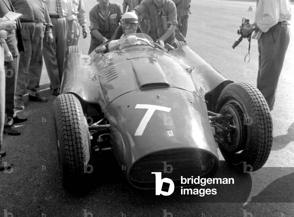 Image of Eugenio Castellotti in a lancia ferrari in the pits, 1956