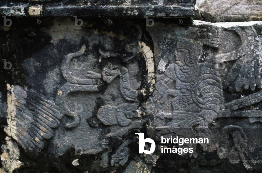 Image of Snakes and warrior with severed heads, relief on wall of