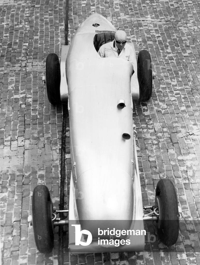 Image of Dave Evans in a racing car, 1935 (b/w photo)