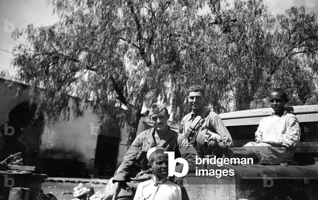 'Italo-Ethiopian War': two Italian soldiers posing with two Ethiopian ...