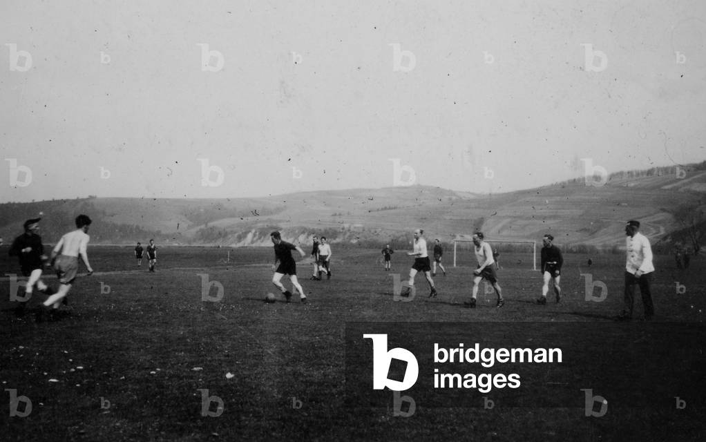 Image of German Soldiers Playing Football, 1942 (b/w photo)