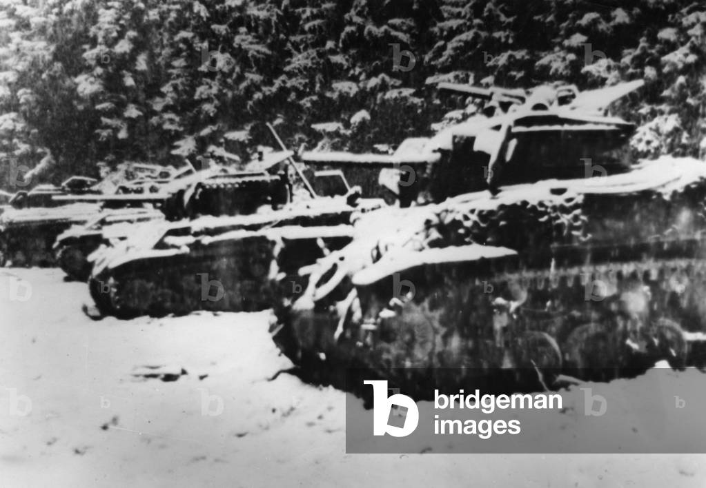Image of Destroyed American Sherman tank in the Ardennes, 1944 (b/w photo)