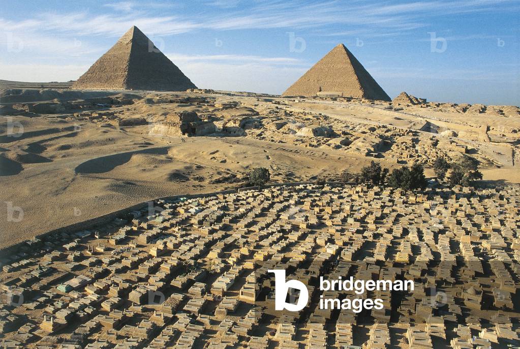 Image of Egypt, Cairo, Giza, Islamic cemetery, with pyramids in background