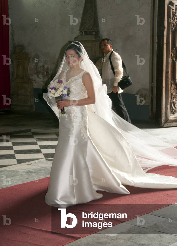Image of Philippines: A bride enters San Agustin (St. Augustine) Church ...