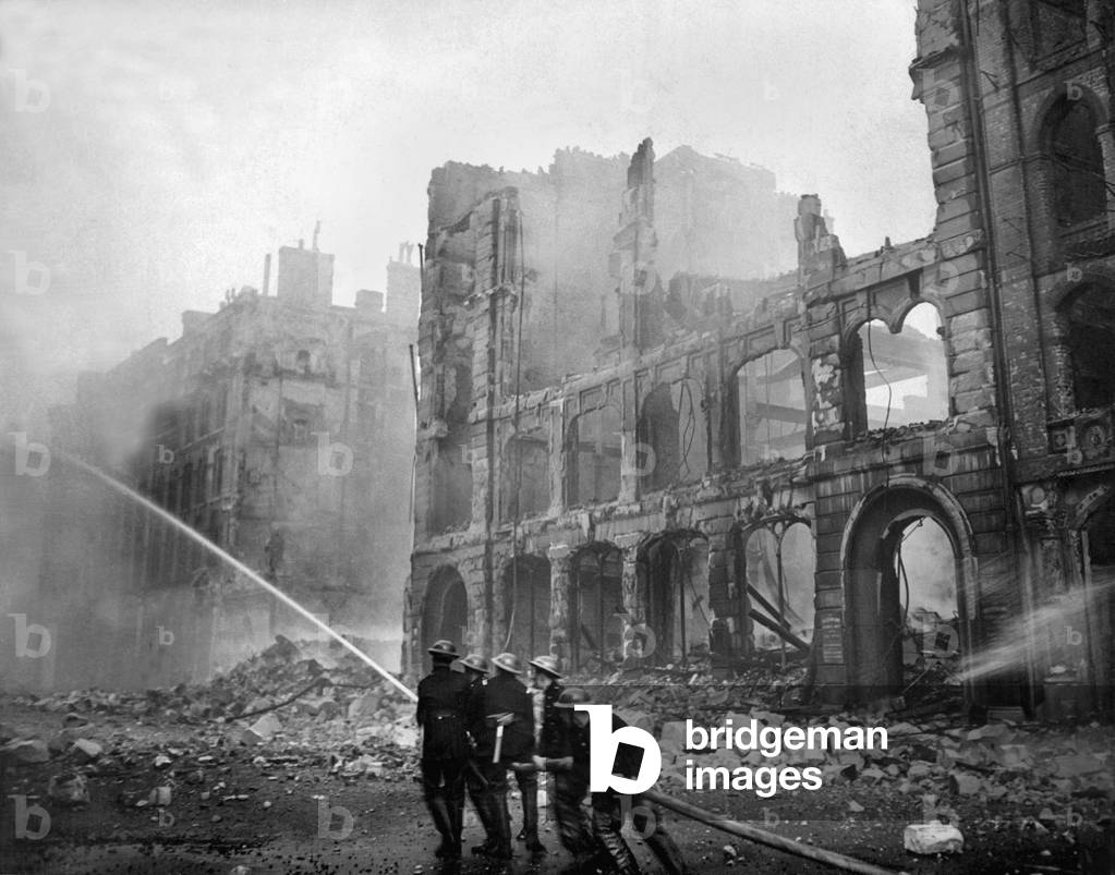 Fire fighting during World War 2 Battle of Britain. Firemen at work in ...