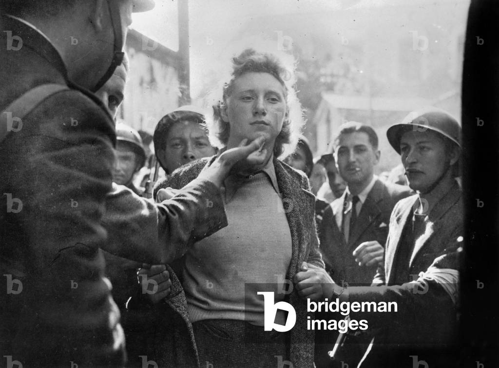 Image of French woman forced by members of the resistance to confess