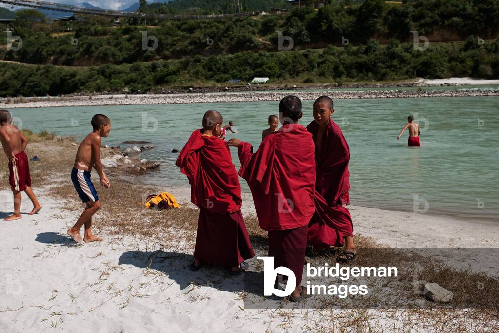 Image of Novice monks by Punakha river, Bhutan (photo)