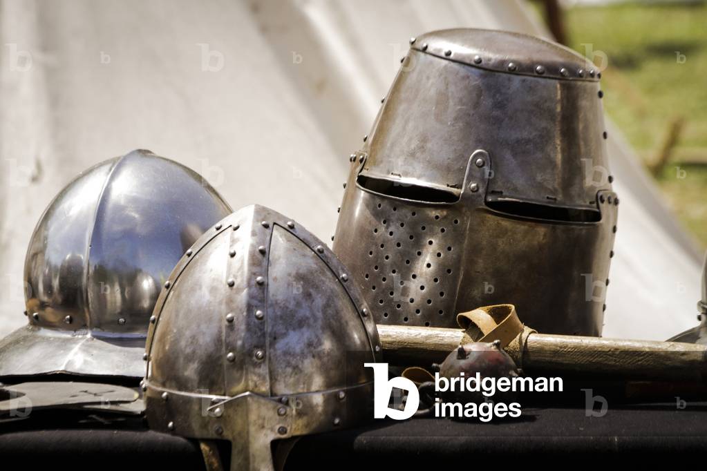 Image of Historical reenactment: Helmets worn by medieval soldiers ...
