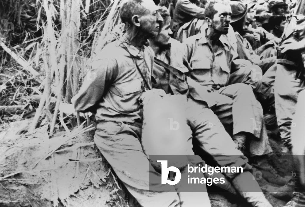 Image of American POWs along the Bataan Death March to a prison