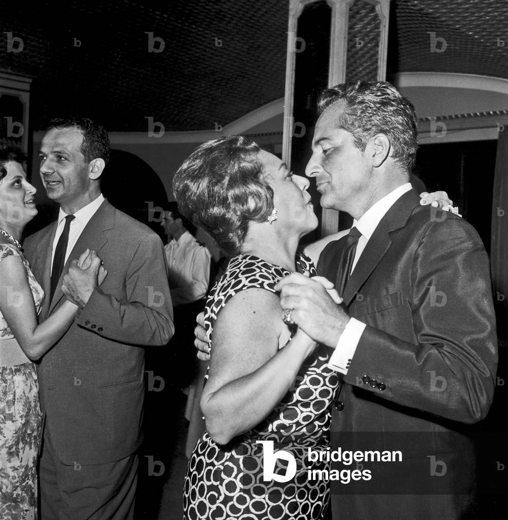 Image of Rossano Brazzi dancing with his wife Lidia Bertolini at a
