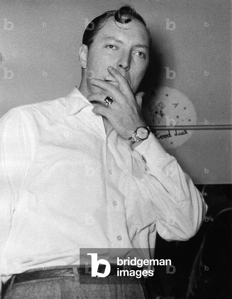 Image of Bill Haley smoking a cigarette, 1955
