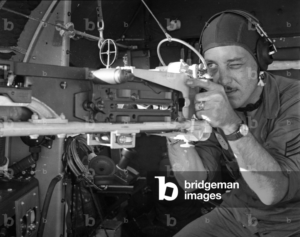 Image of Gunner with machine gun in a B-17 during training at by ...
