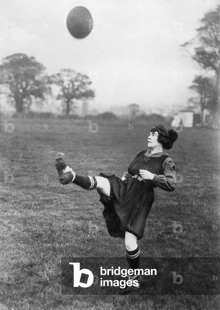 Image of Woman playing soccer, 1919 (b/w photo)