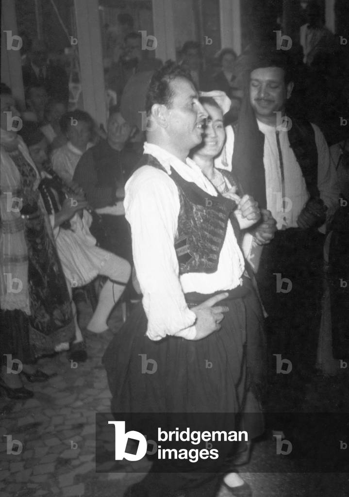 Image of A folk dance with traditional clothing of locals in Athens,