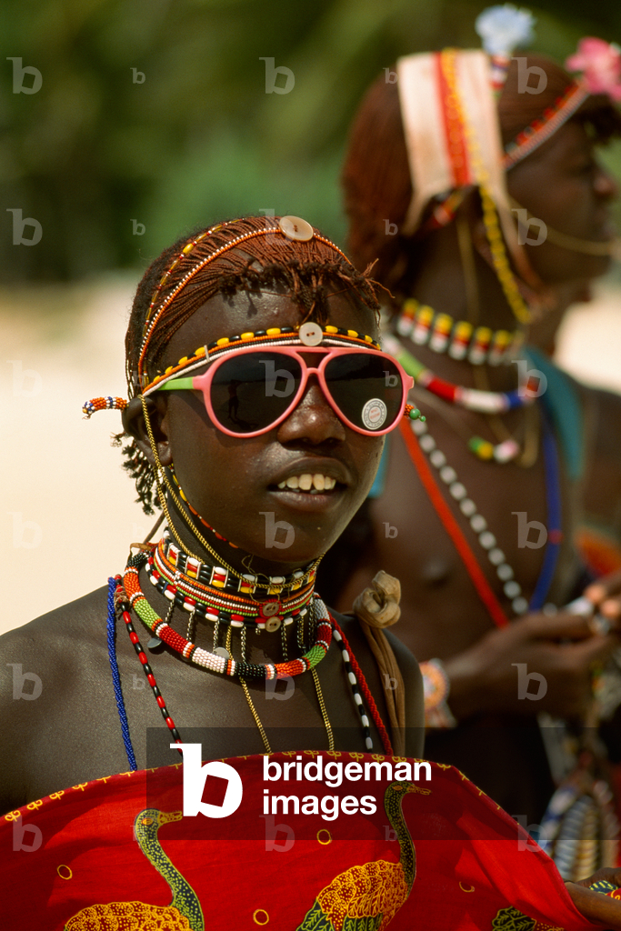 Image of A Masai tribesman wearing sunglasses, traditional clothing ...