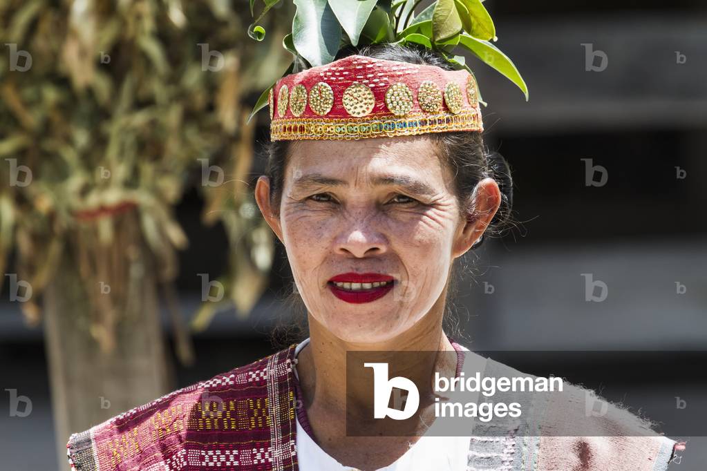 Image of Toba Batak woman in traditional costume at Huta Bolon Museum