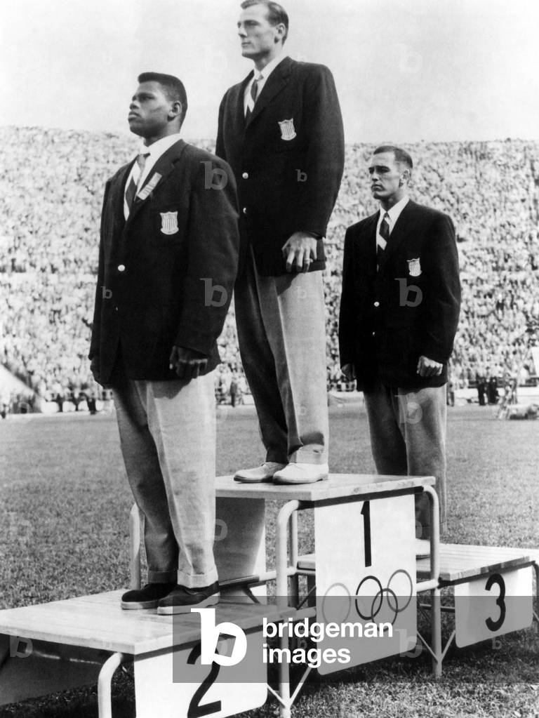 Image of Decathlete Bob Mathias (center), receiving first place gold ...