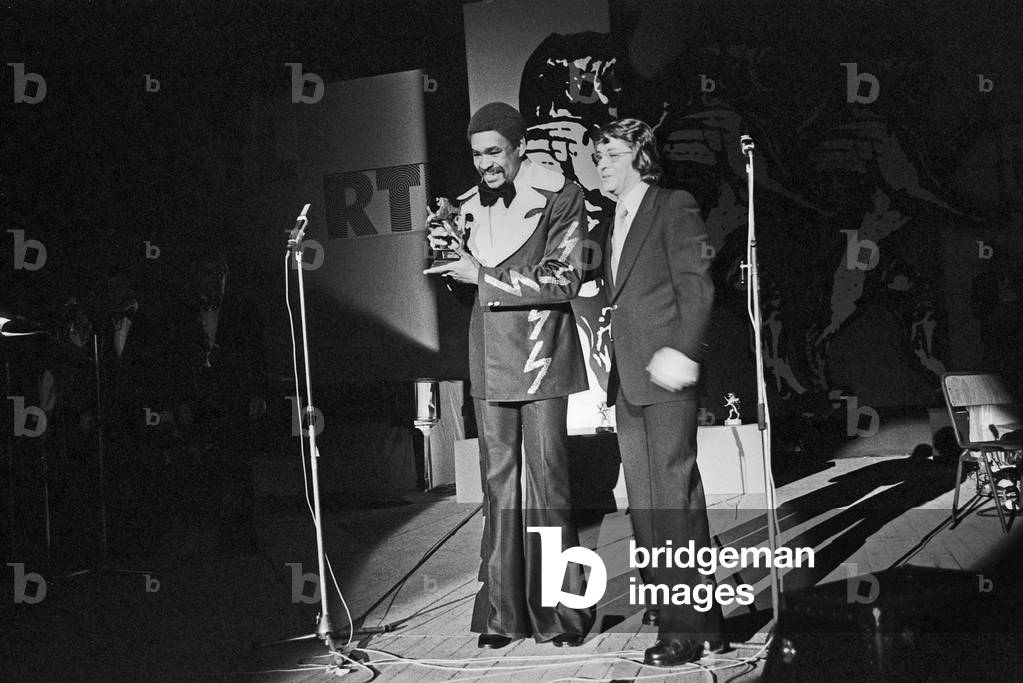 Image of American pop and R&B singer George McCrae (left) live on