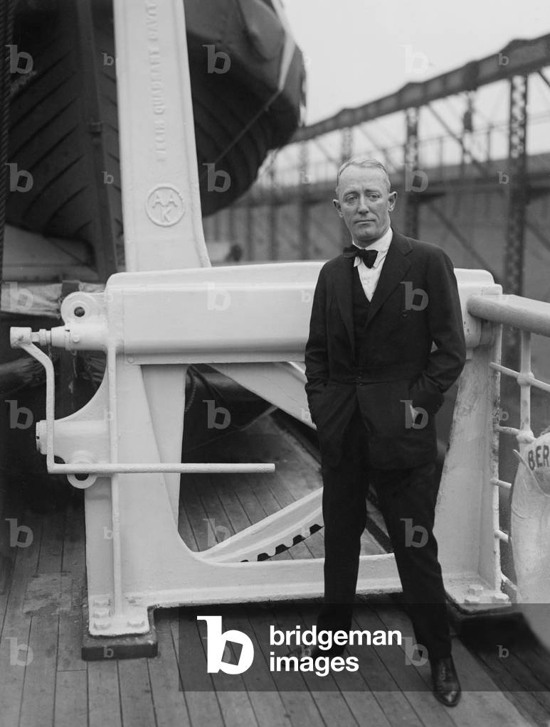 Image of George M. Cohan (1878-1942), poses for photographers on the deck