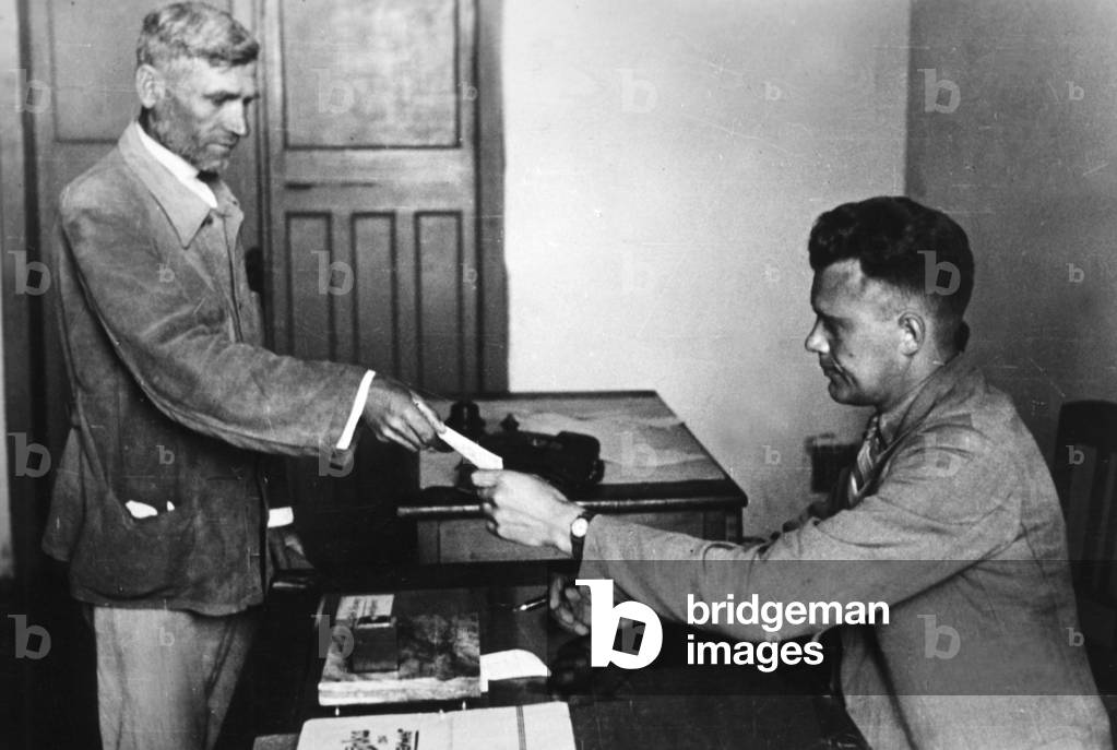 Image of Russian worker at a german government in Russia, 1942 (b/w