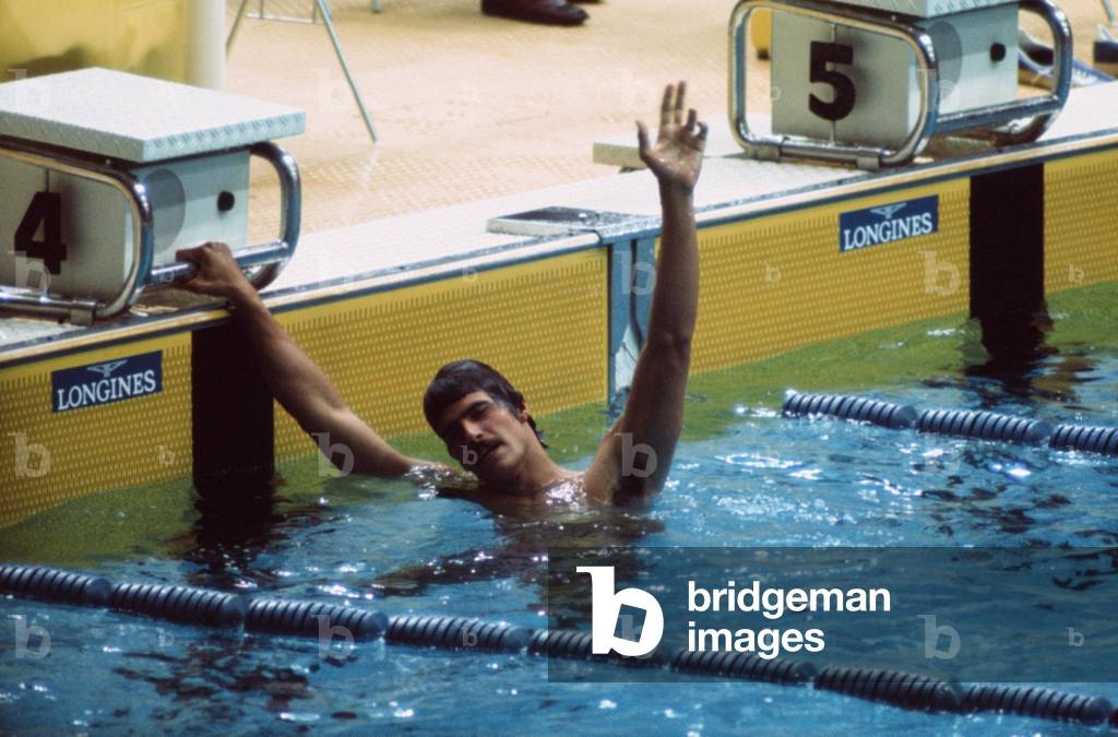 Image of Mark Spitz exults for his olympic victory in Munich, 1972