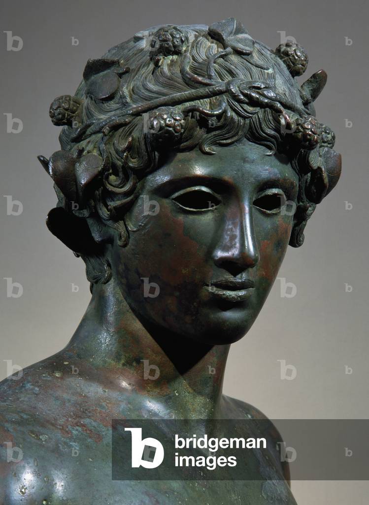 Image of Detail of ephebos' head crowned with ivy, bronze statue from