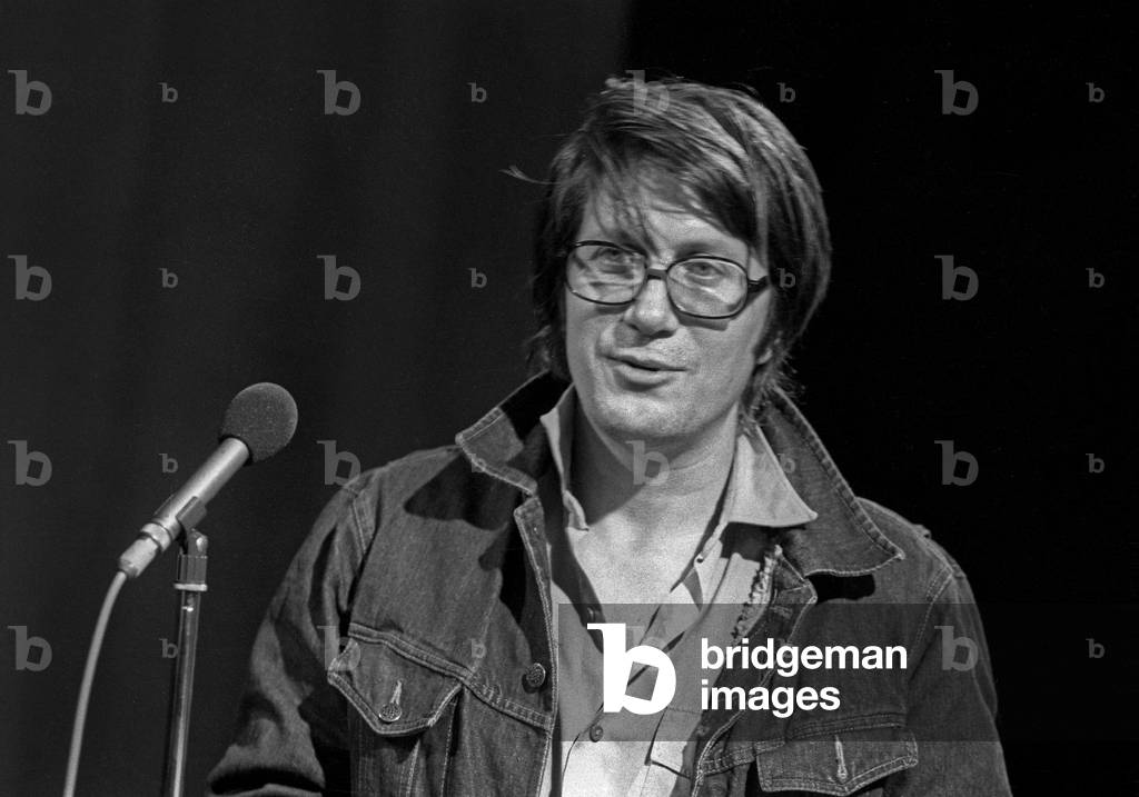 Image of French singer Jacques Dutronc singing during the recording of the