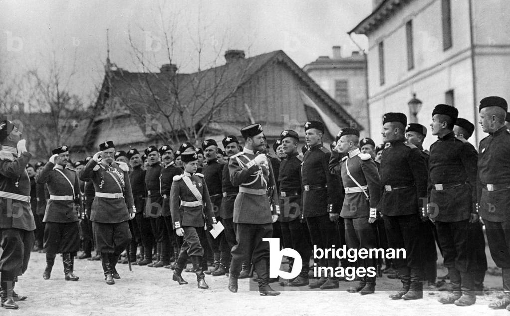 Image of Nicholas II, accompanied by the Tsarevich, inspects a guards ...