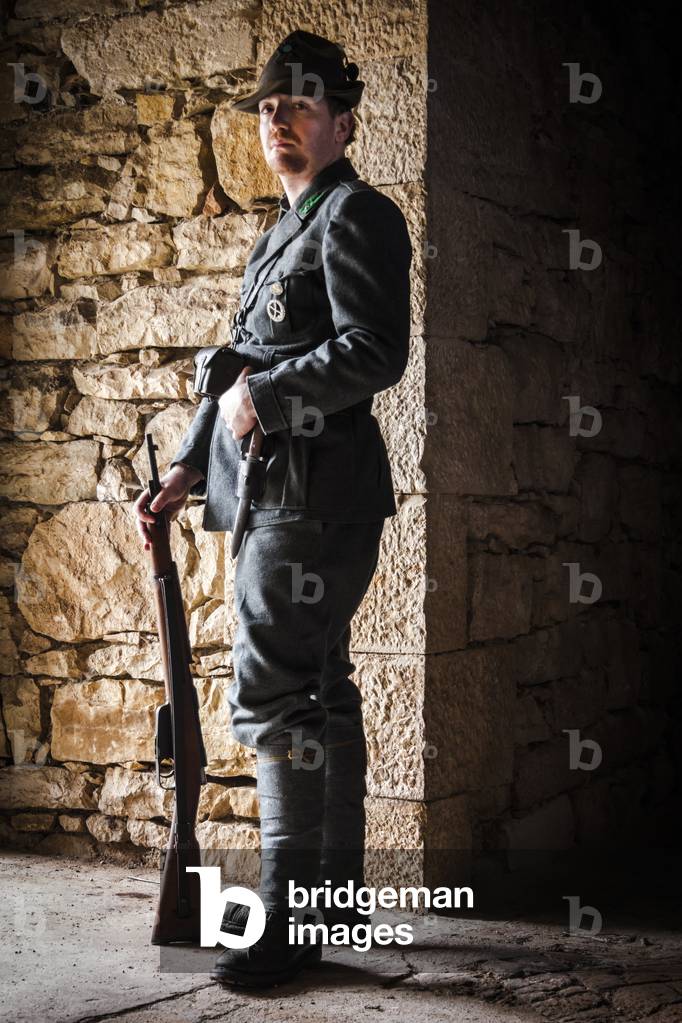 Image of Historical reenactment: Soldier from 9th Alpine Regiment with ...
