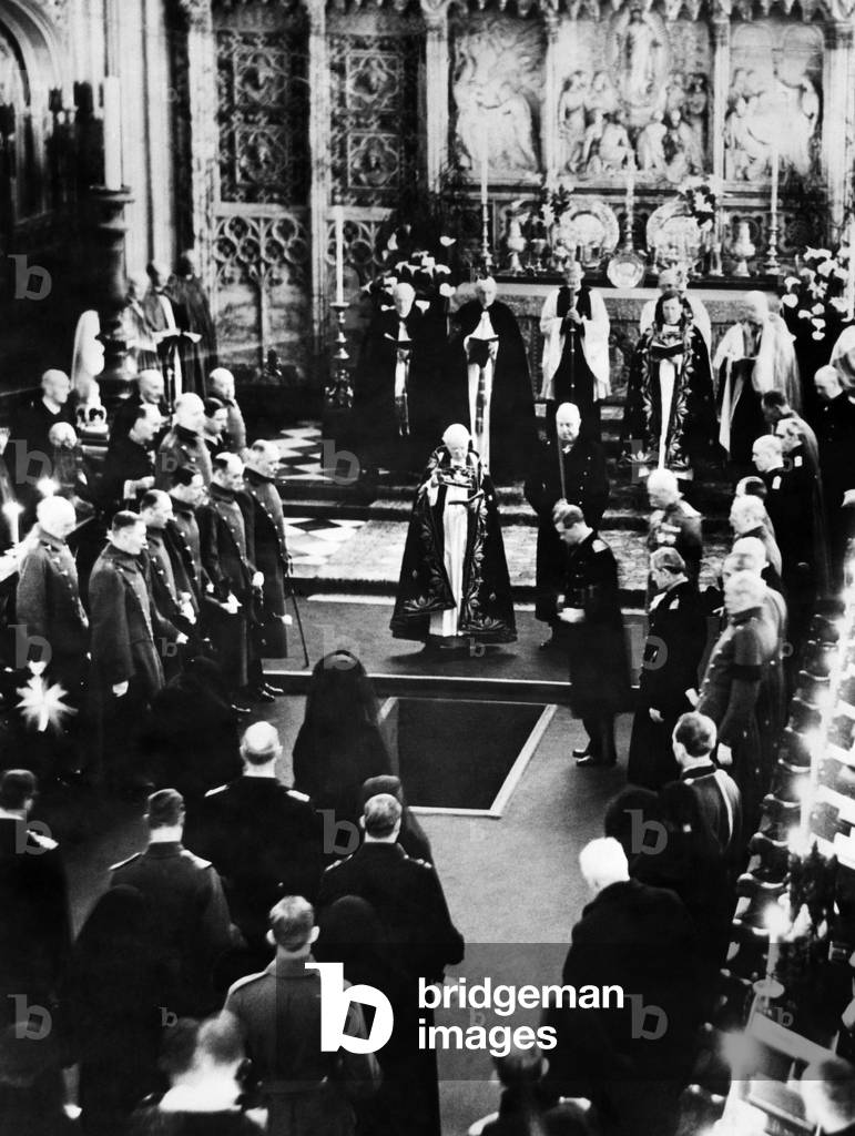 Image of British Royal Family. Center, behind crypt: Archbishop of ...