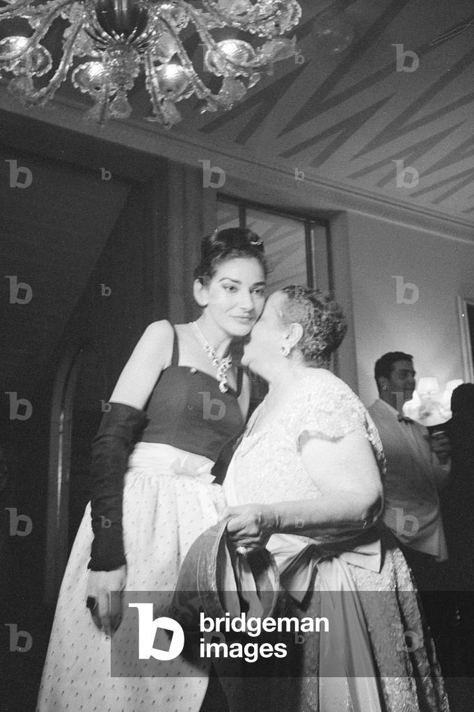 Image of Maria Callas cheek to cheek with Elsa Maxwell, Italy, 1957
