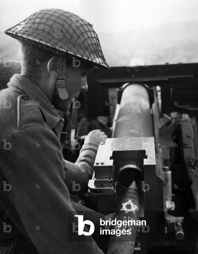 Image of A soldier loading a gun
