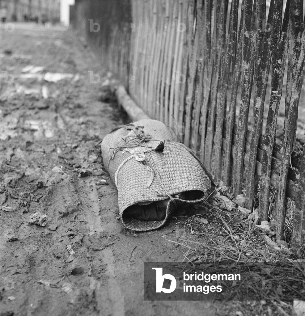 Image of Wrapped corpse left for municipal collection as family too poor,