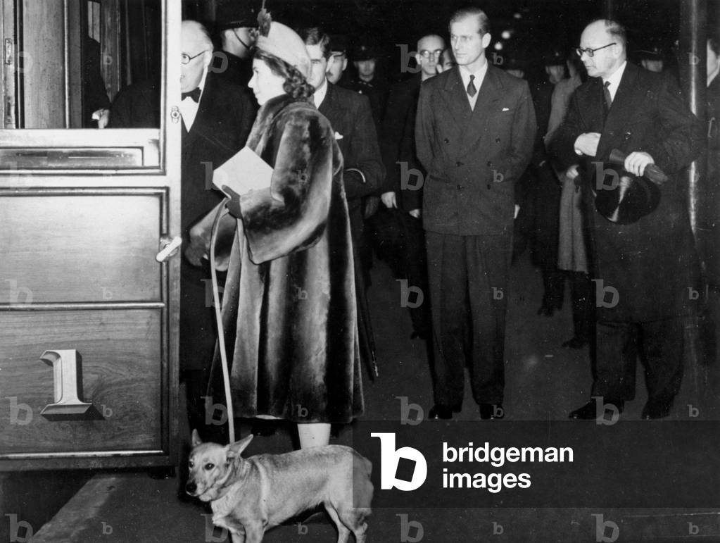 Image of Princess Elizabeth, together with her pet corgi, board the Royal