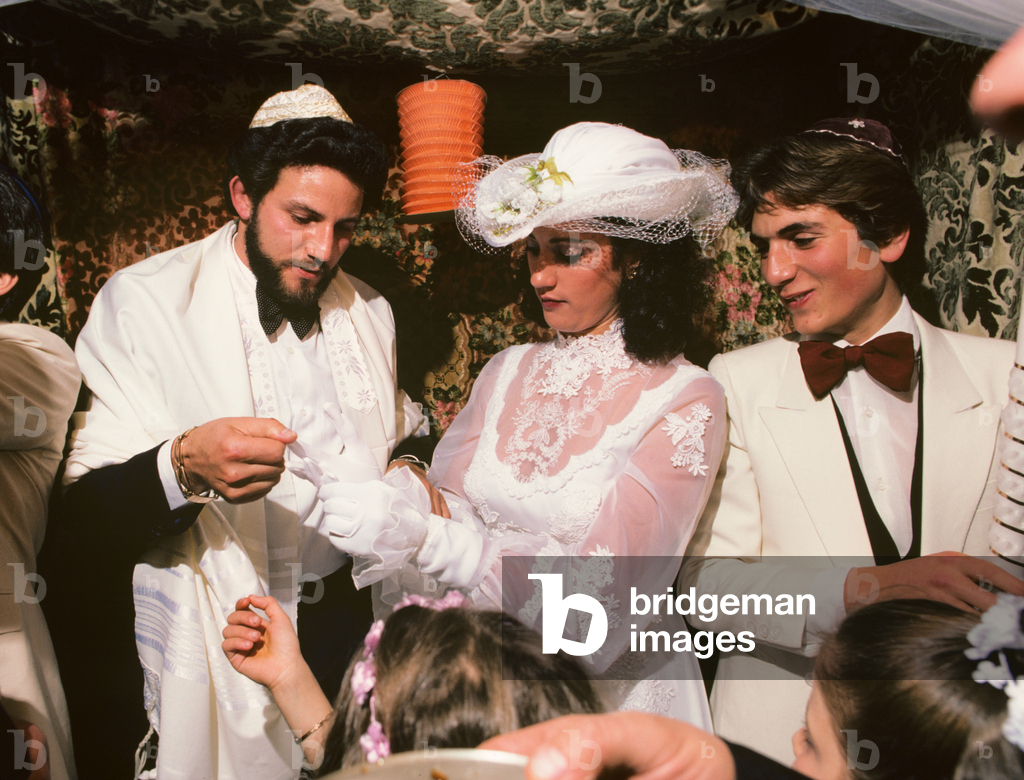 Image of Bride and groom under a hoopa (chuppah) in Jewish wedding by ...