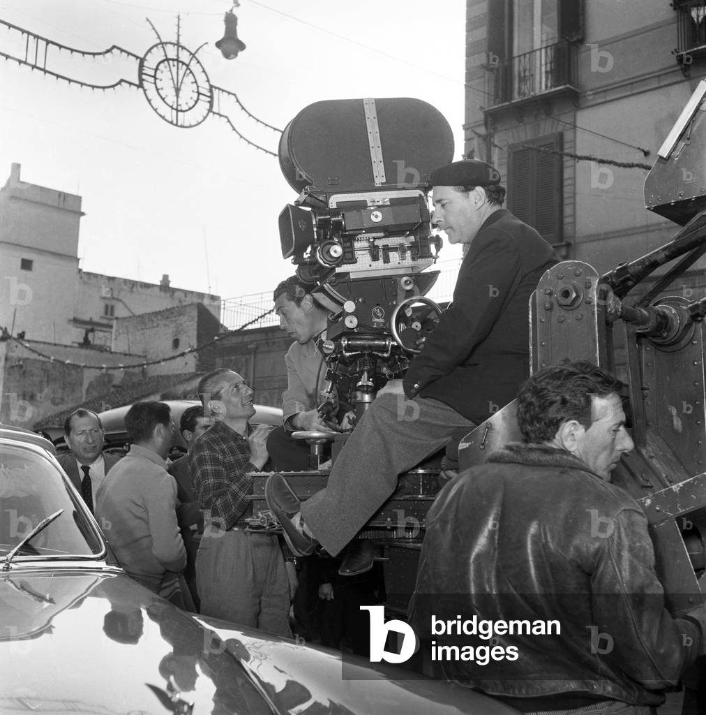 Image of Roberto Rossellini behind the camera on the set of his