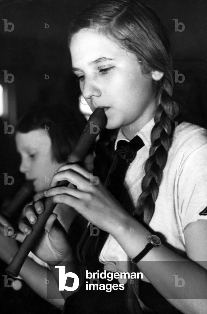 Image of BDM girls (League of German Girls) playing the flute, 1937
