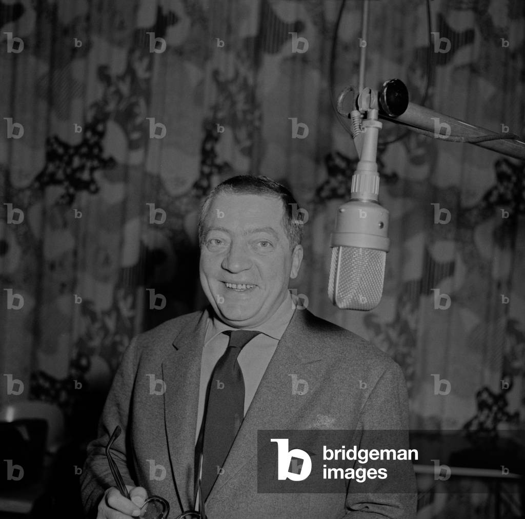 Image of German actor Josef Dahmen at the microphone at German TV