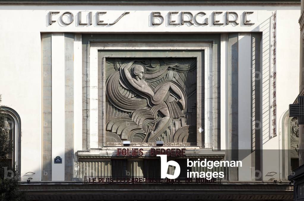 Image of Facade of the Folies Bergere theatre, showing a dancer in